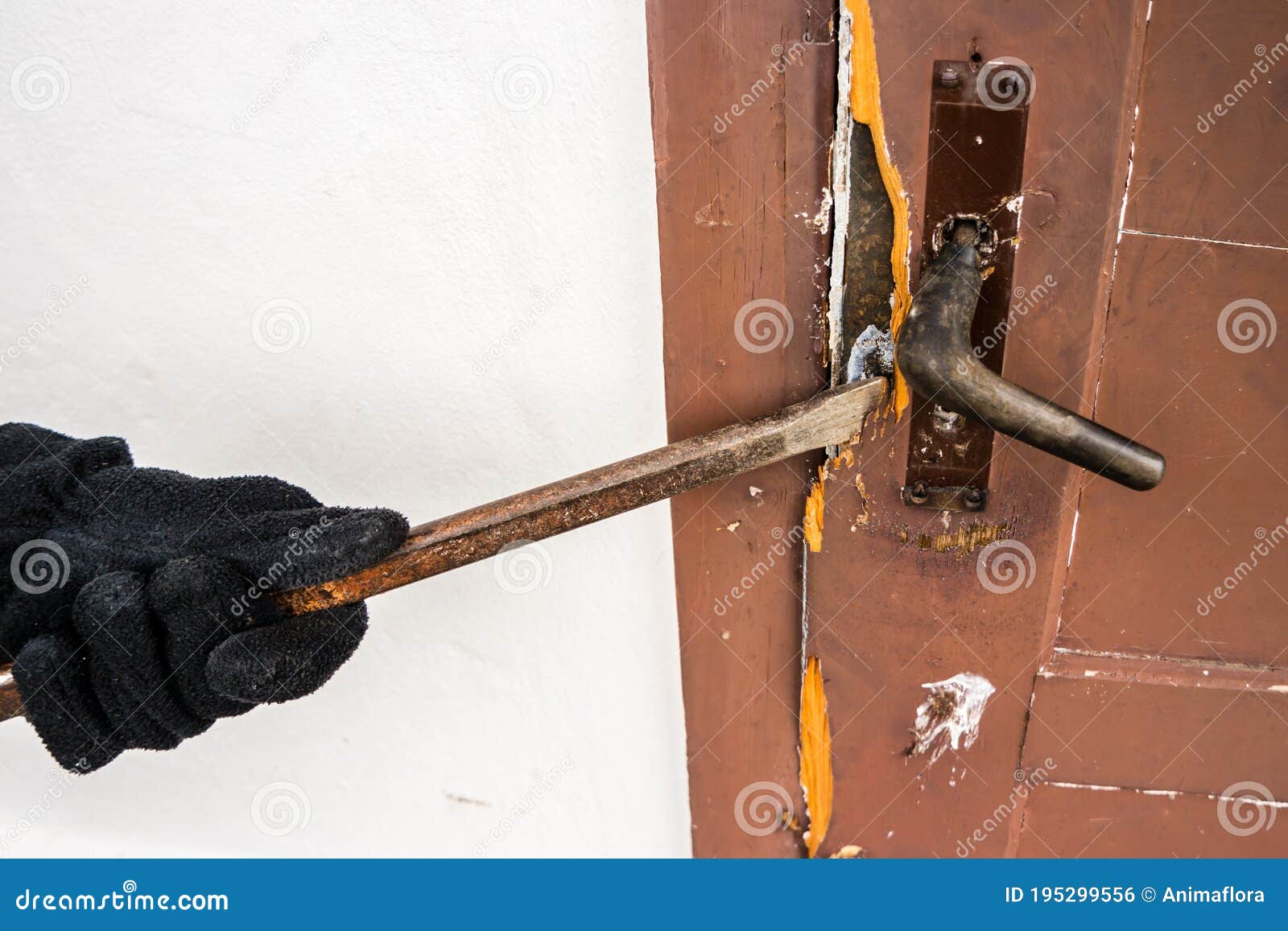 Burglar breaks open a door stock photo. Image of alarm - 195299556