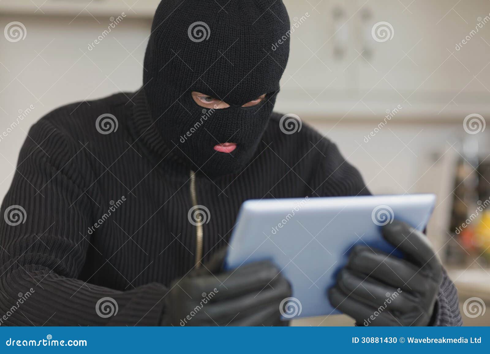 Burglar holding tablet pc stock photo. Image of kitchen - 30881430