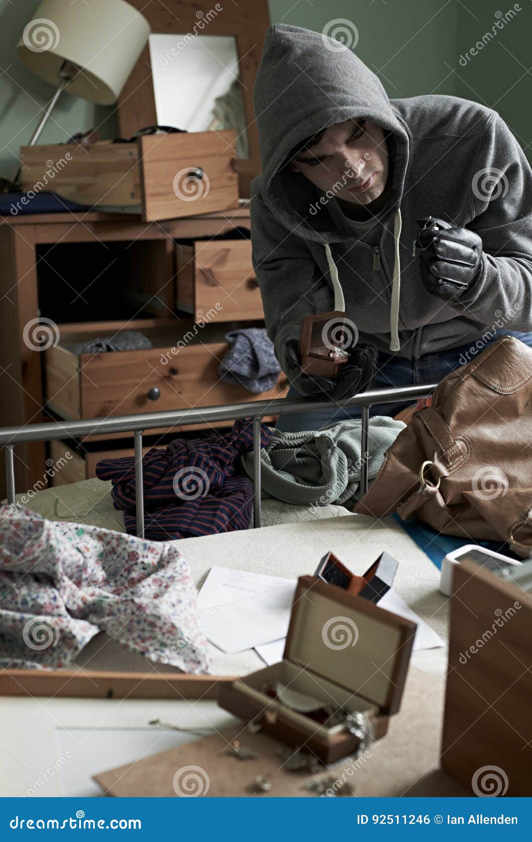 Burglar Stealing Items from Bedroom during House Break in Stock Photo ...