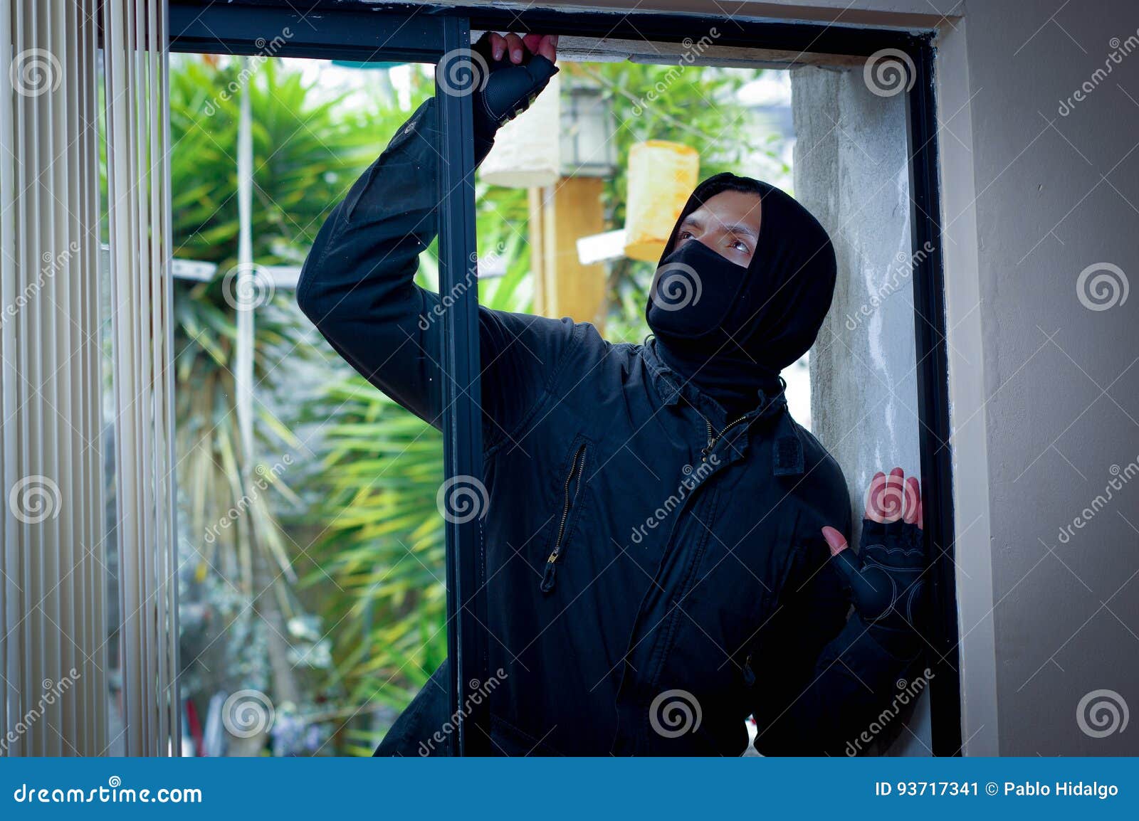 Burglar Trying Break the Window To Enter the House Stock Image - Image ...