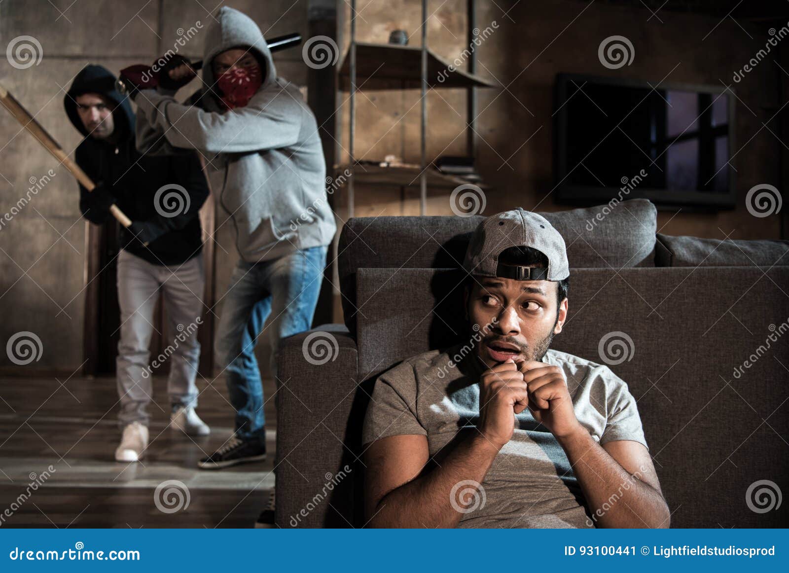 Burglars and scared man stock image. Image of sofa, burglary - 93100441