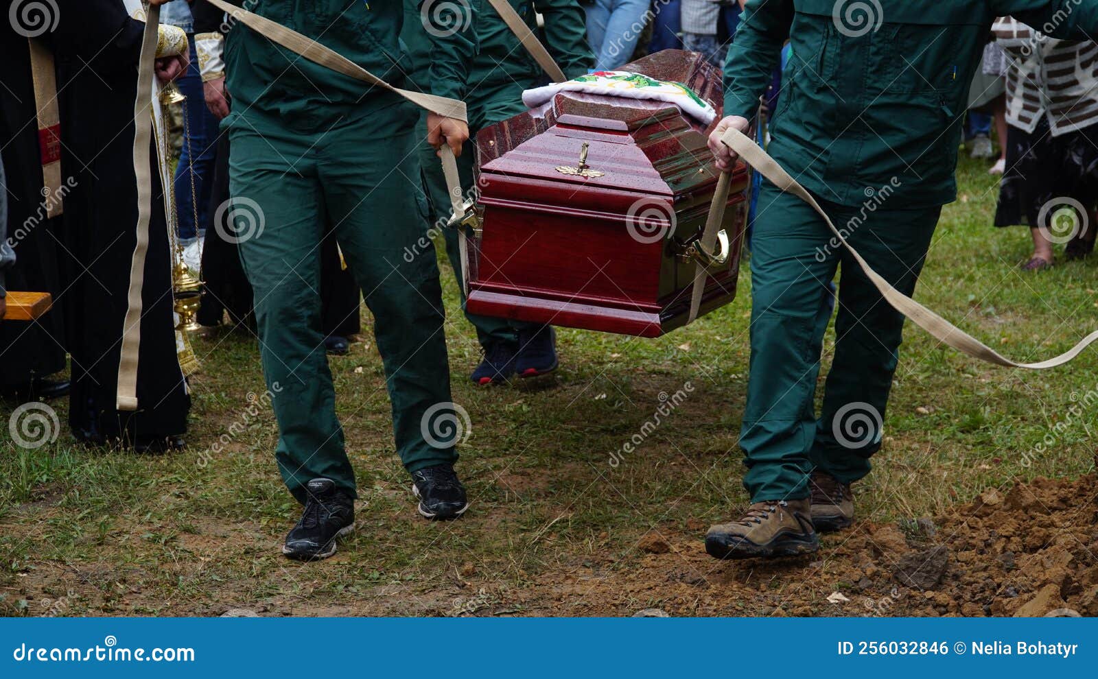 Burial. Men Lower the Coffin into the Grave. N Stock Photo - Image of ...