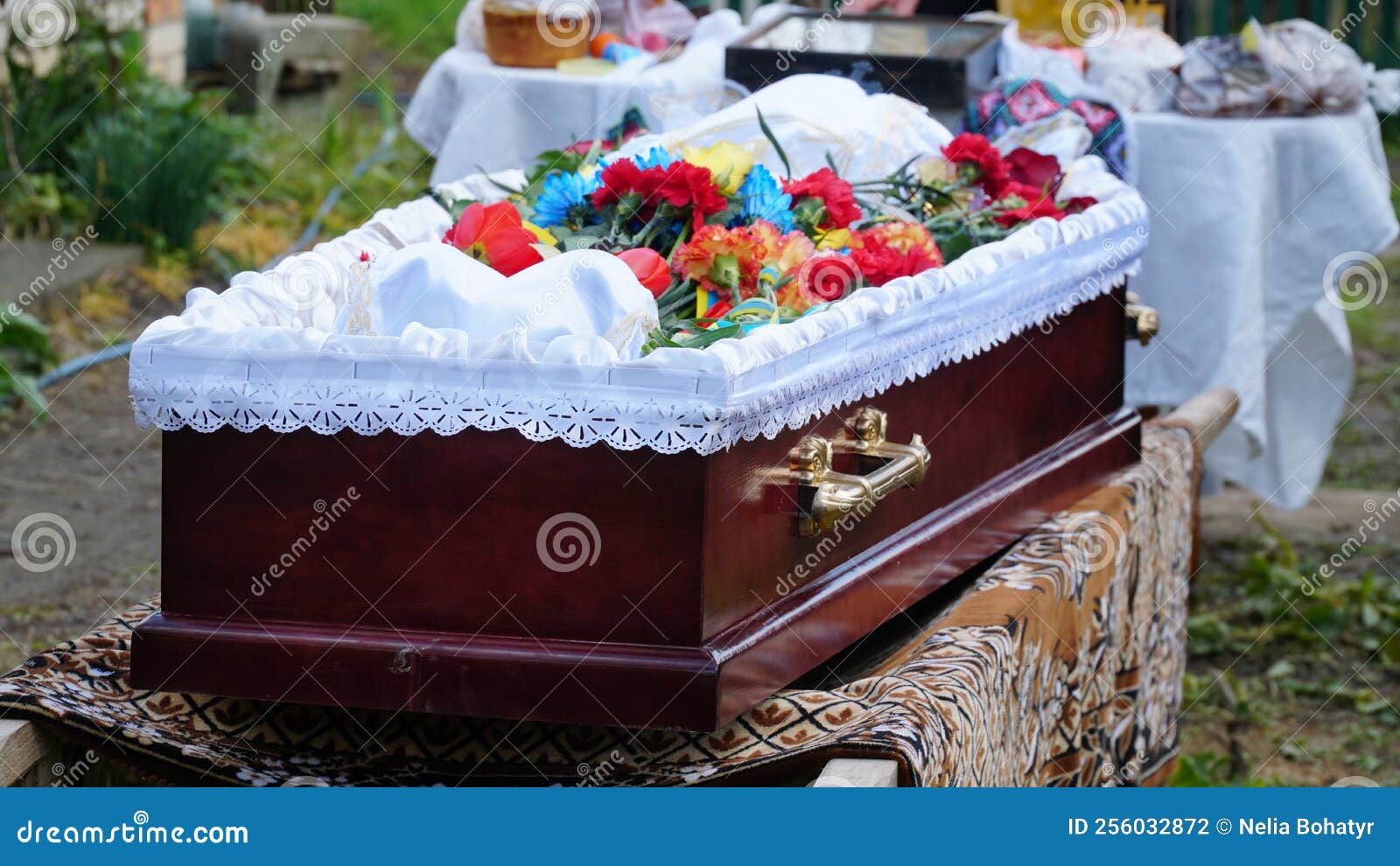 Burial. Men Lower the Coffin into the Grave. N Stock Photo - Image of ...