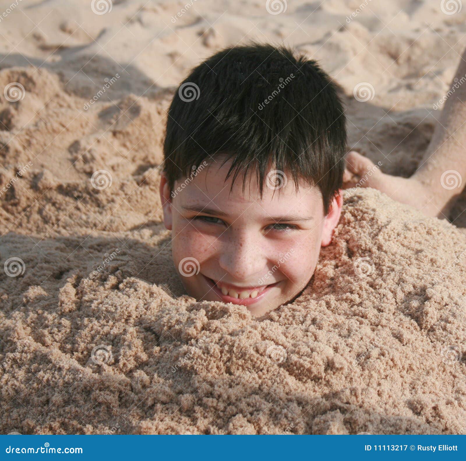 Buried in Sand stock image. Image of island, young, prince - 11113217