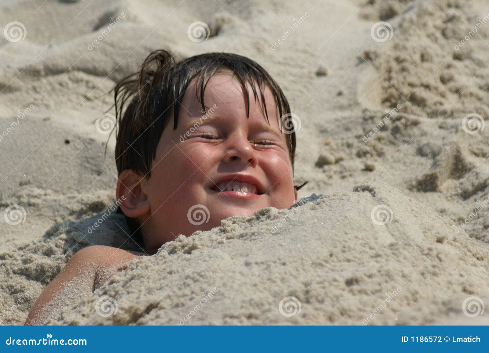 Buried in sand stock photo. Image of laughing, cover, squinting - 1186572