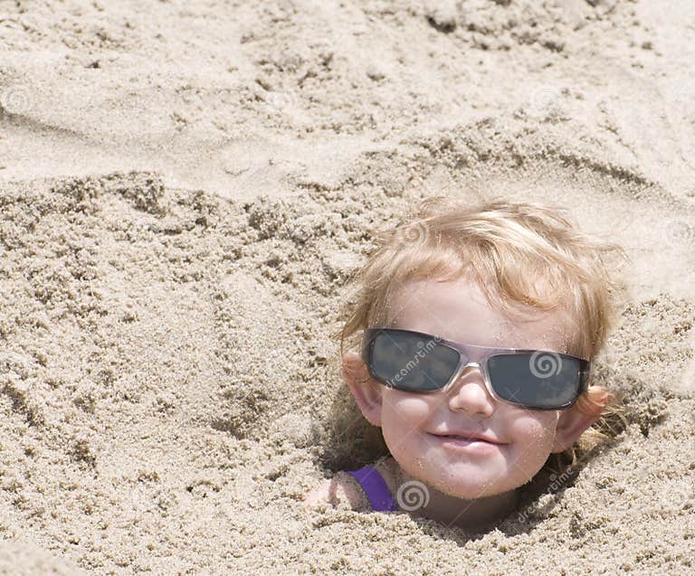 Buried in the sand stock image. Image of child, outdoors - 6965363