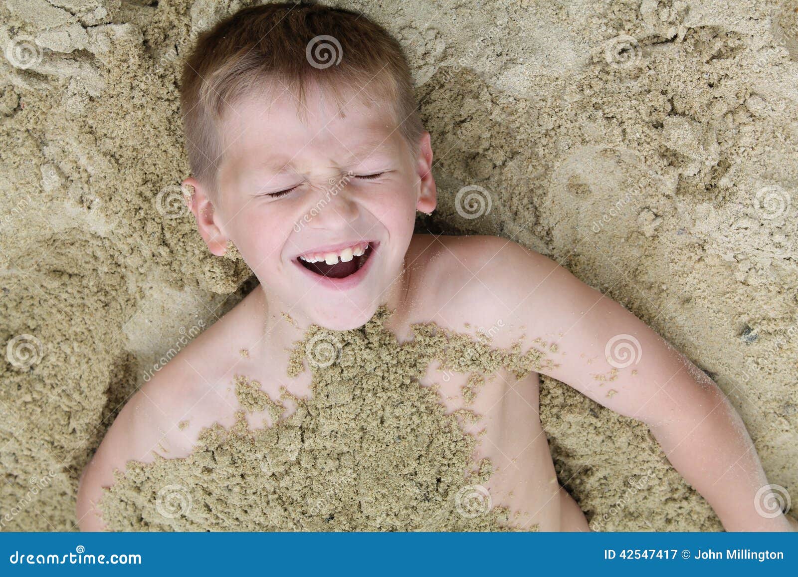 Buried in the sand editorial photography. Image of happy - 42547417