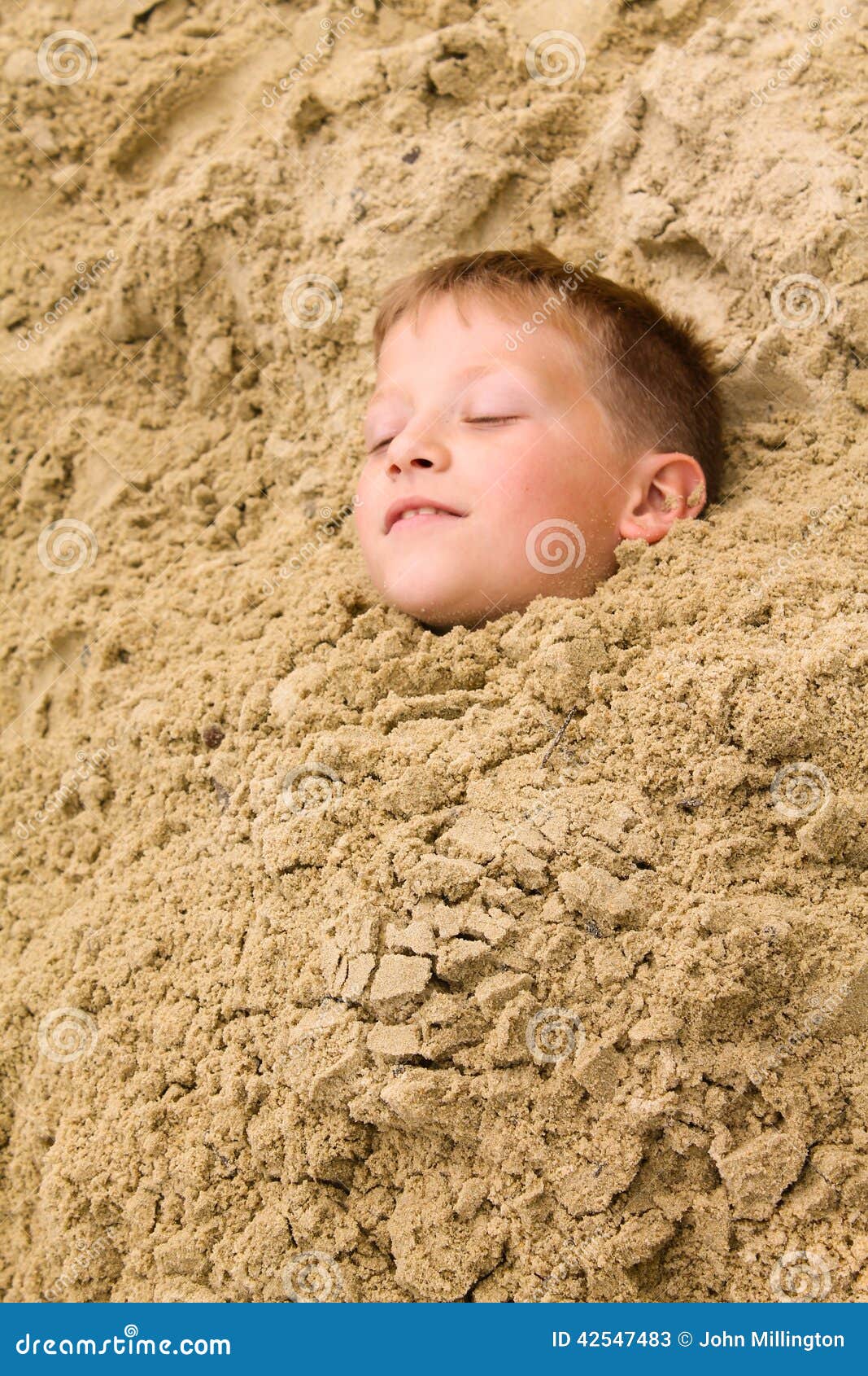 Buried in the sand editorial stock photo. Image of childhood - 42547483