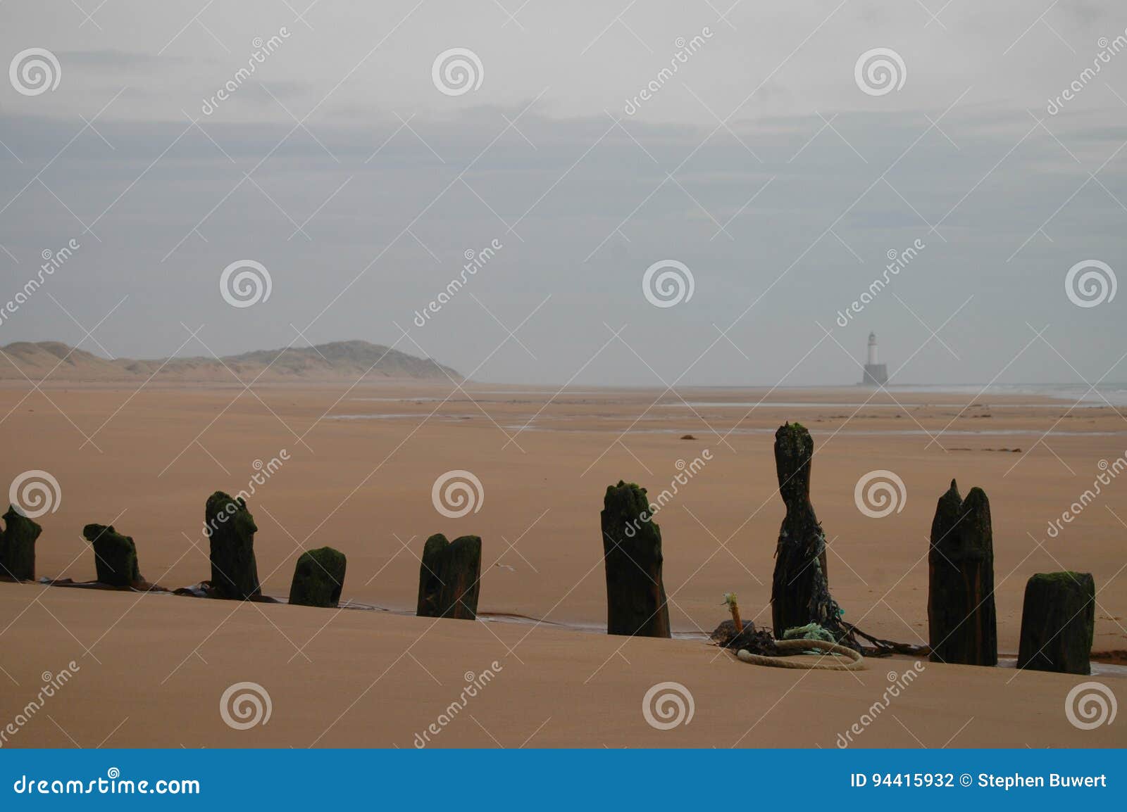 Buried Shipwreck and Lighthouse Stock Photo - Image of eerie ...