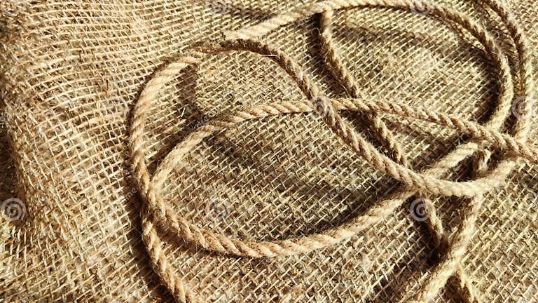 Burlap Fabric, Coarse Jute Weave, and Thick Burlap Rope. Background ...