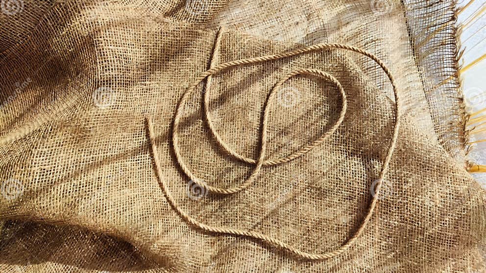 Burlap Fabric, Coarse Jute Weave, and Thick Burlap Rope. Background ...