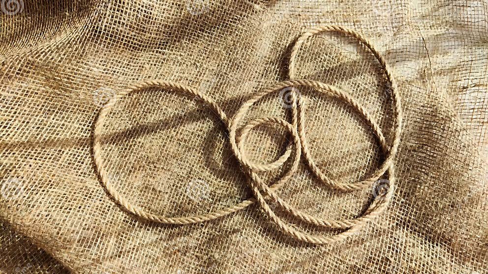 Burlap Fabric, Coarse Jute Weave, and Thick Burlap Rope. Background ...