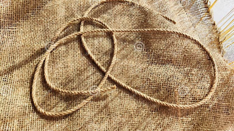 Burlap Fabric, Coarse Jute Weave, and Thick Burlap Rope. Background ...