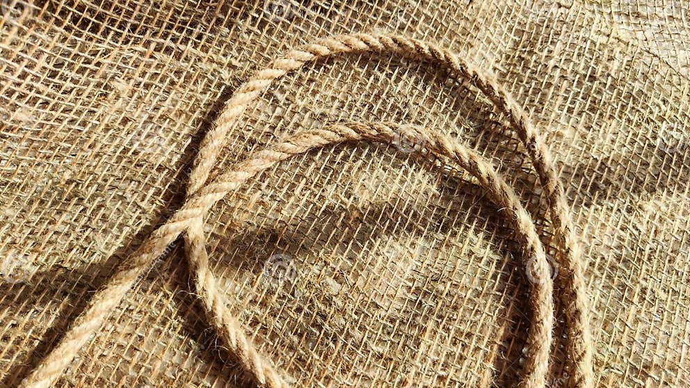 Burlap Fabric, Coarse Jute Weave, and Thick Burlap Rope. Background ...