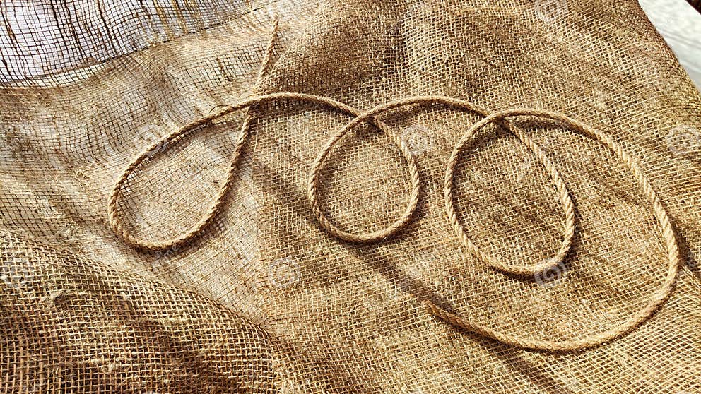 Burlap Fabric, Coarse Jute Weave, and Thick Burlap Rope. Background ...