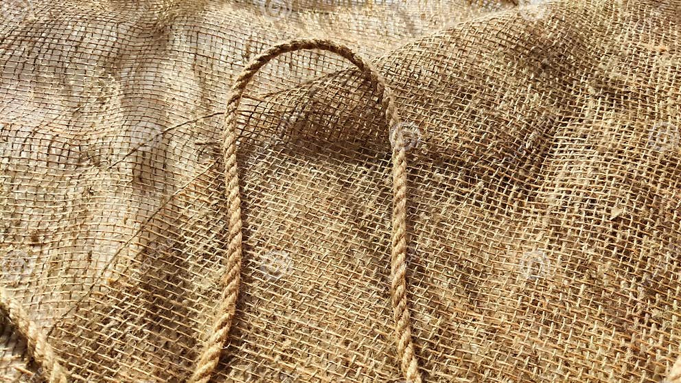 Burlap Fabric, Coarse Jute Weave, and Thick Burlap Rope. Background ...