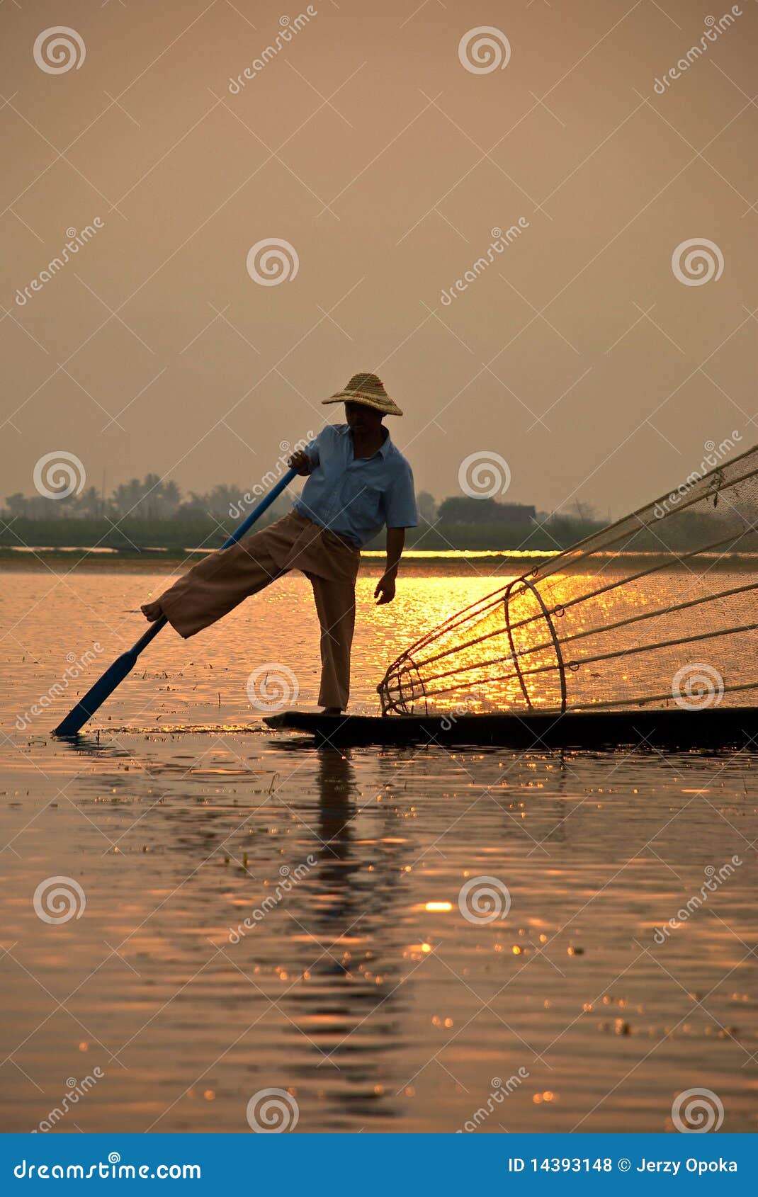 Burmese Fisherman Leaning On Oar Posing In Traditional Clothes With ...