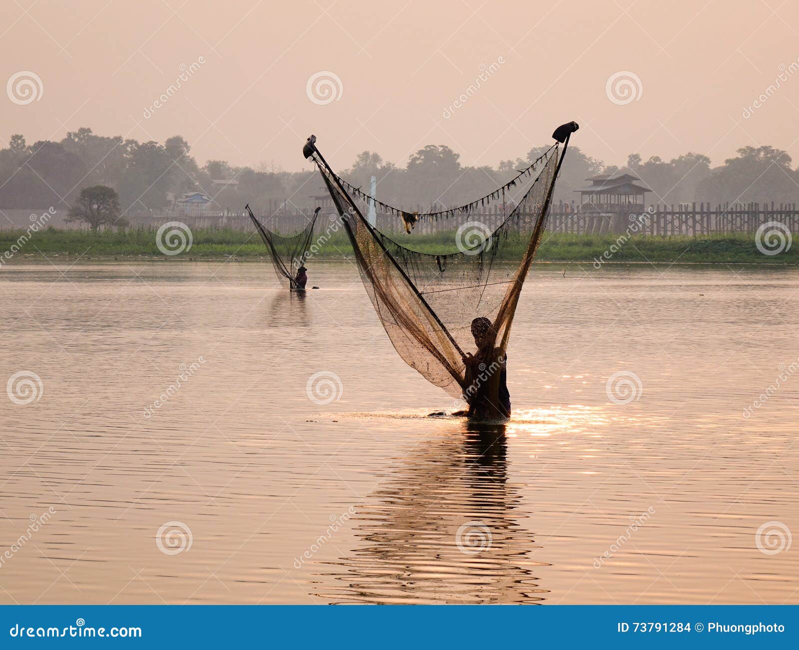 A Burmese Man Catching Fish on the River in Mandalay, Myanmar Editorial ...