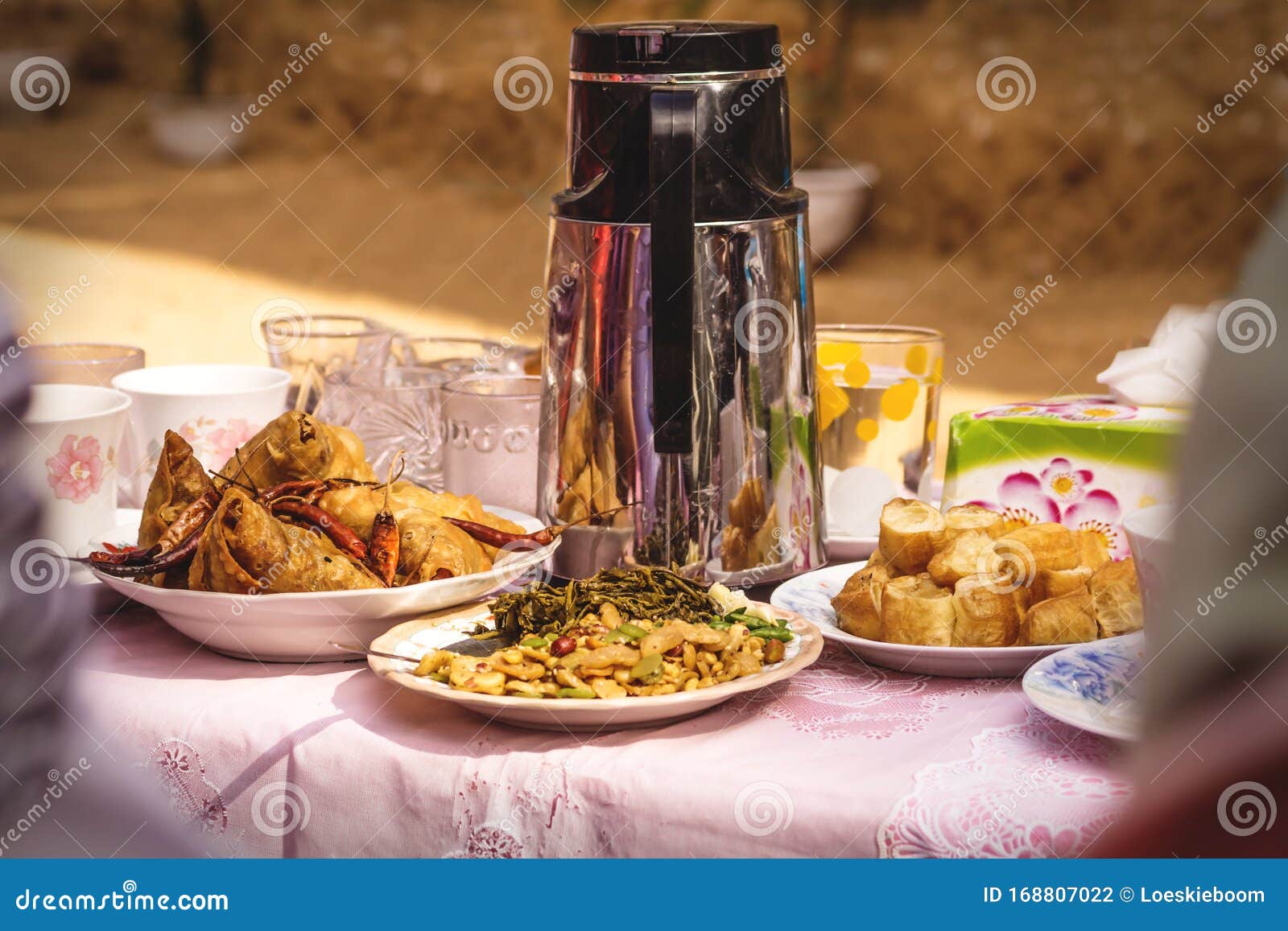 Burmese Snacks with Fried Vegetables and Peanuts on Table with Tea Pot ...