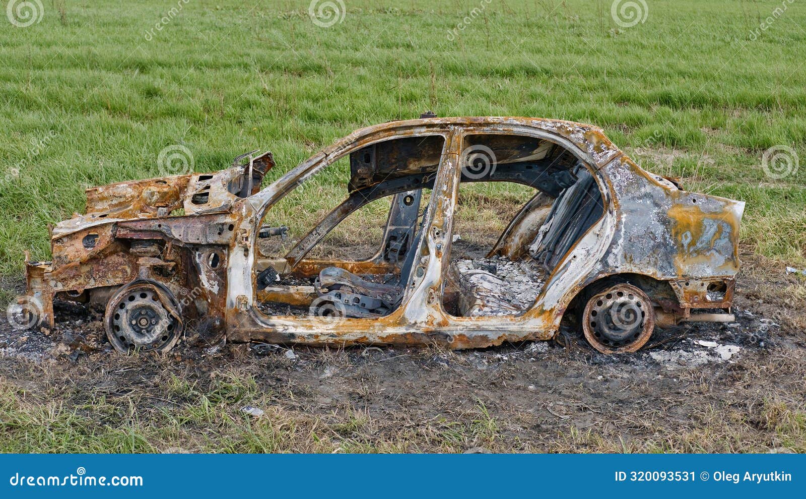 Burned Down Car in the Field. Full Destroyed Vehicle Stock Image ...
