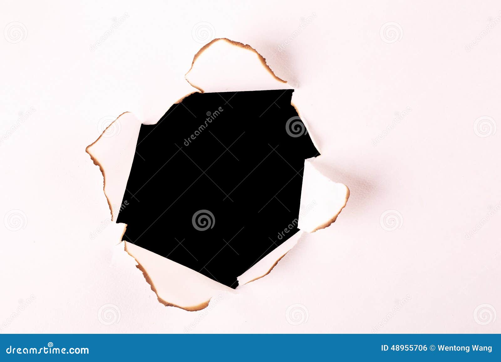 Burned Hole in Paper Against a White Background Stock Photo - Image of ...