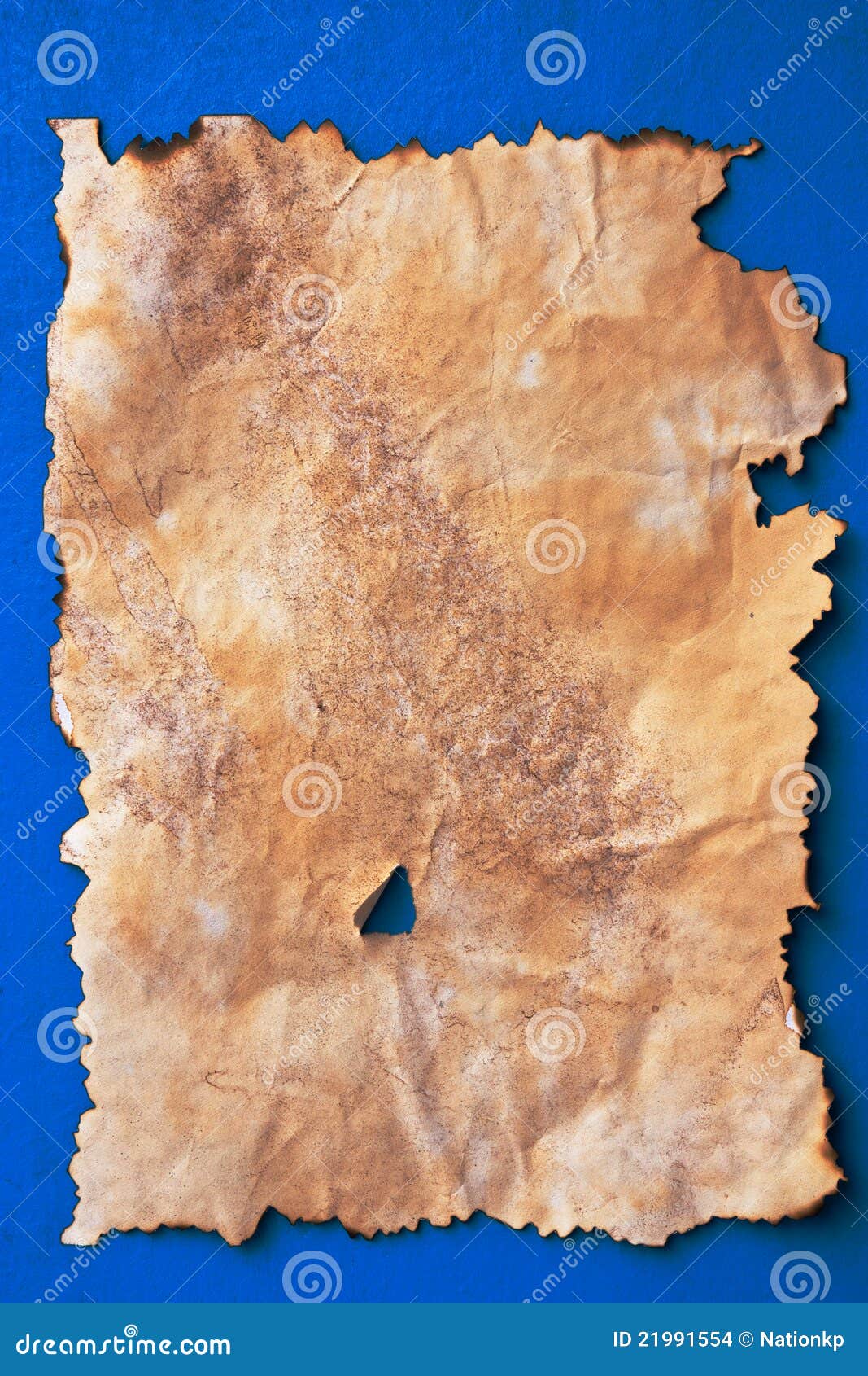 Burned Paper on Blue Backdround Stock Photo - Image of background ...