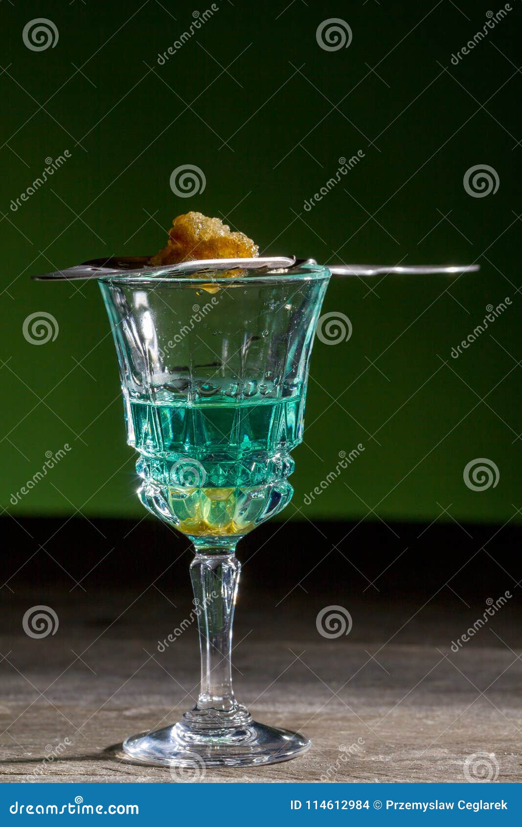 Burning Sugar on Spoon in Glass of Absinthe Stock Photo - Image of ...