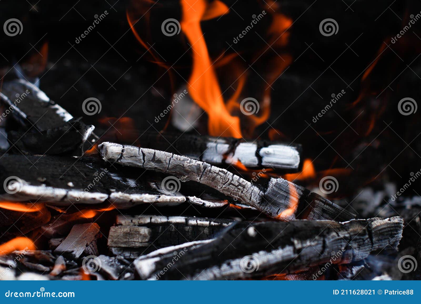 Burned Wood with Flames Still Burning, Dark Stone Background of Camp ...
