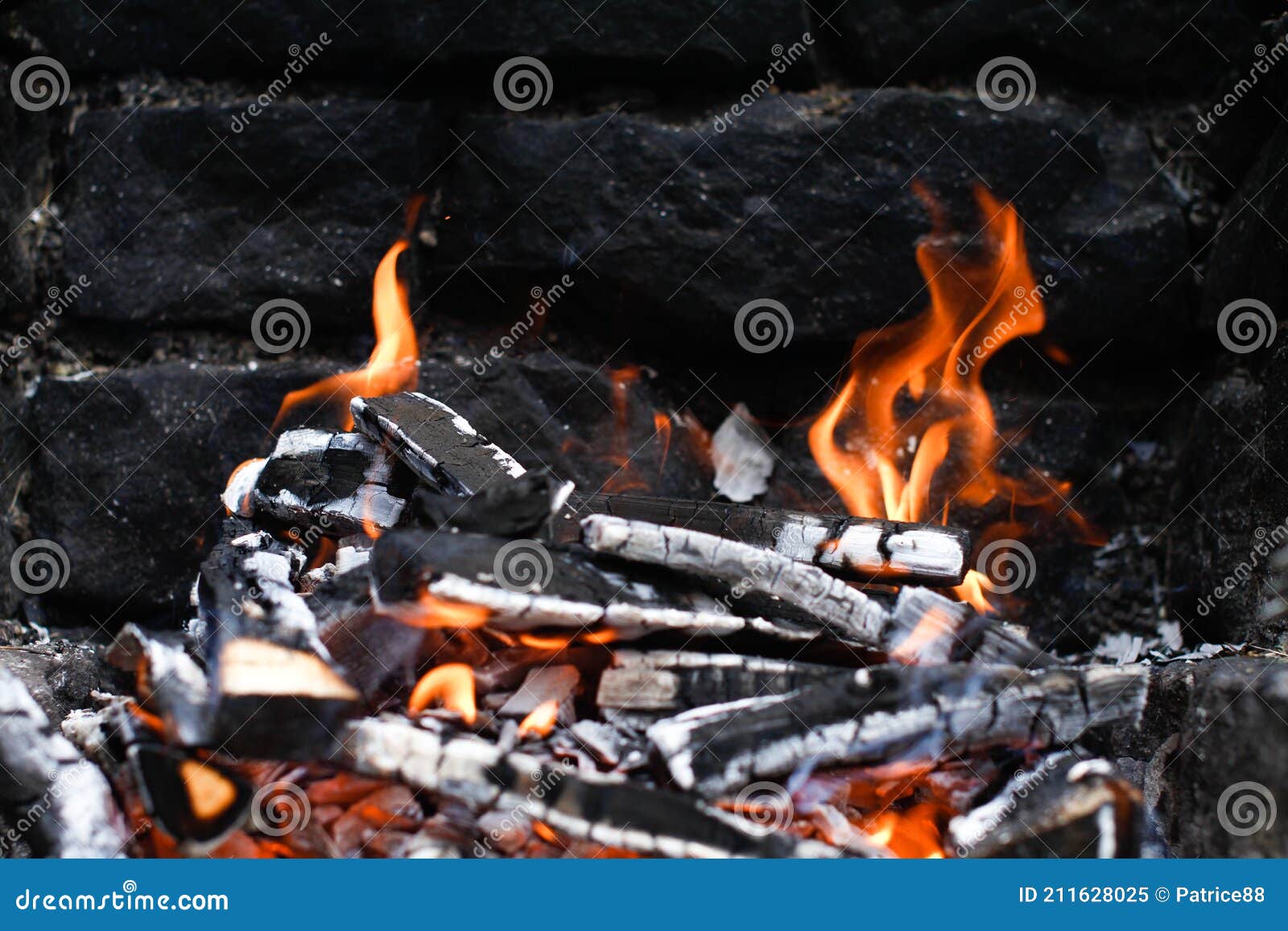 Burned Wood with Flames Still Burning, Dark Stone Background of Camp ...