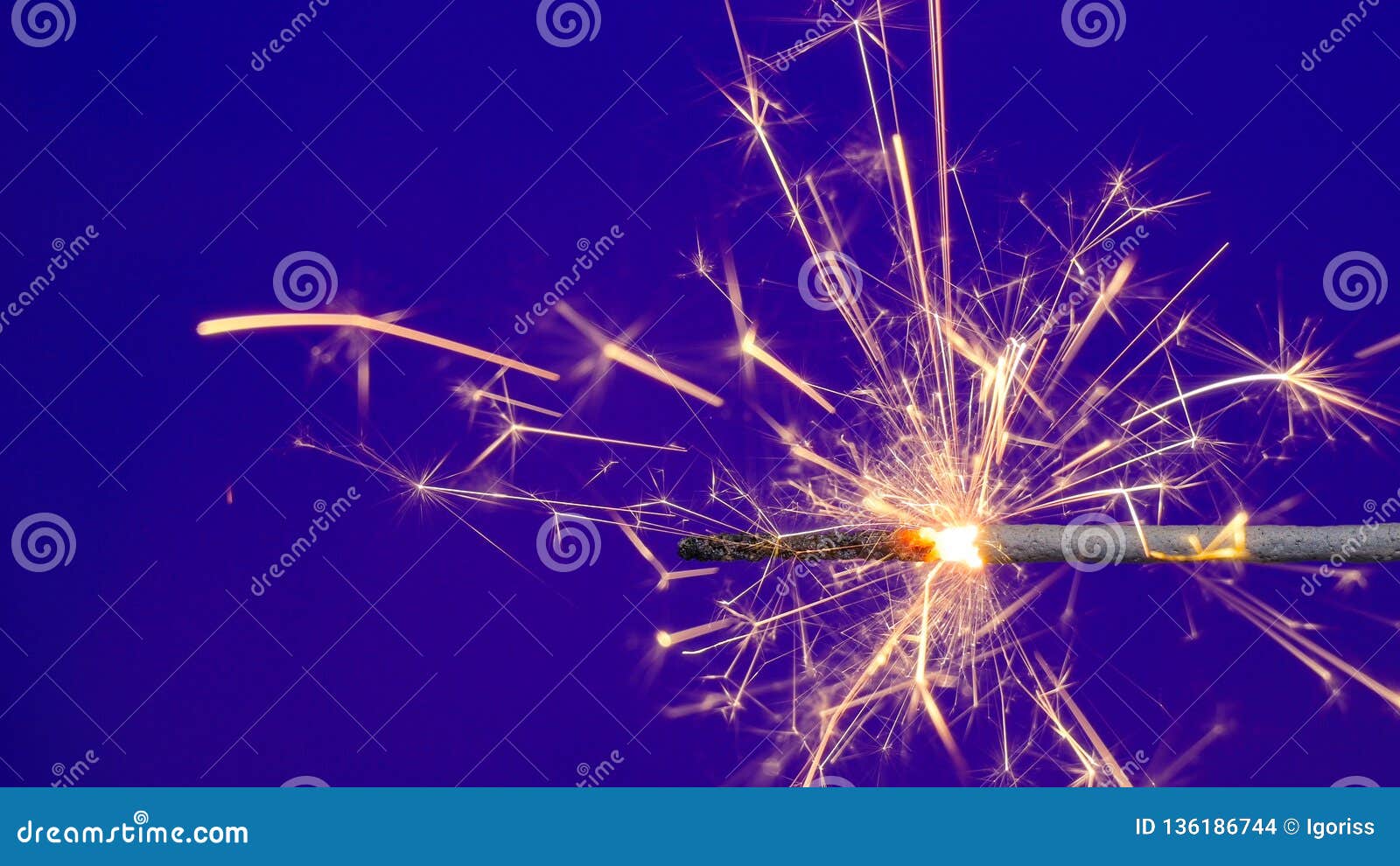 Burning Bengal Fire on Blue Background Stock Photo - Image of christmas ...
