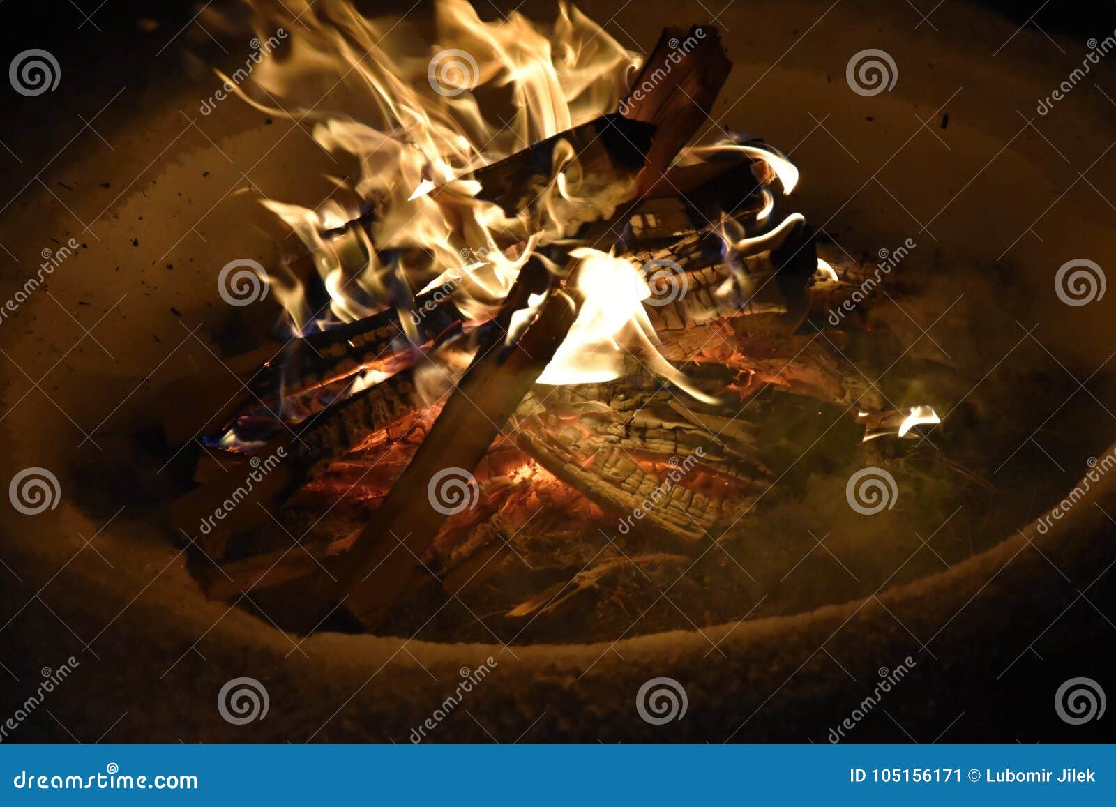 Burning Bonfire in the Snow in Winter and at Night. Stock Image - Image ...