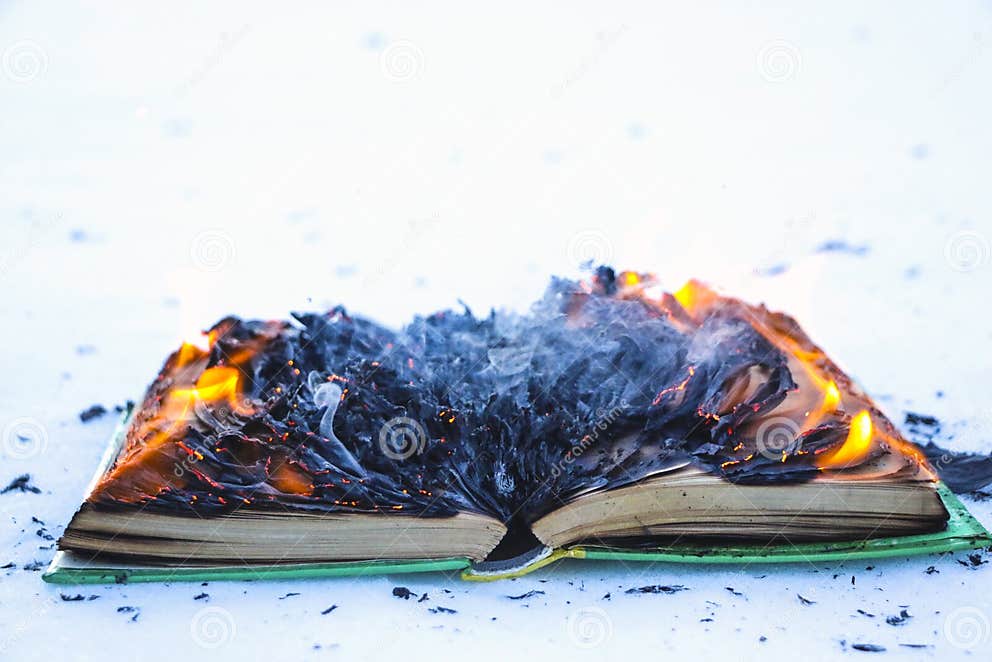 Burning Book in Snow. Pages with the Text in Open Book Burn with Bright ...
