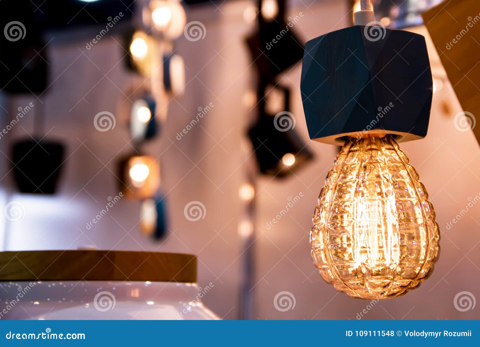 Burning Bulb Shines Weakly on the Background Blurred Yellow Romantic ...