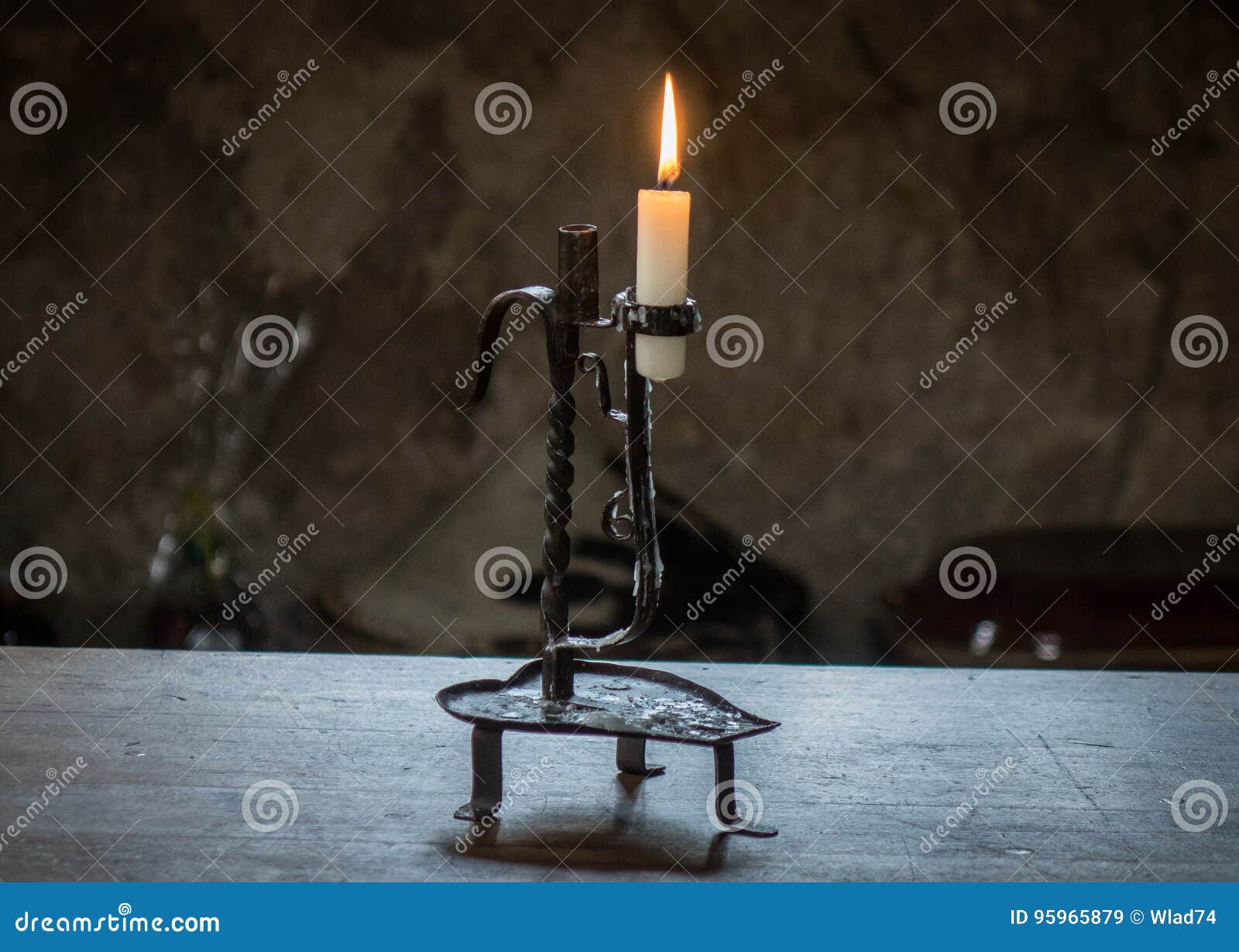 The Burning Candle in an Old Candlestick Stock Image - Image of burning ...