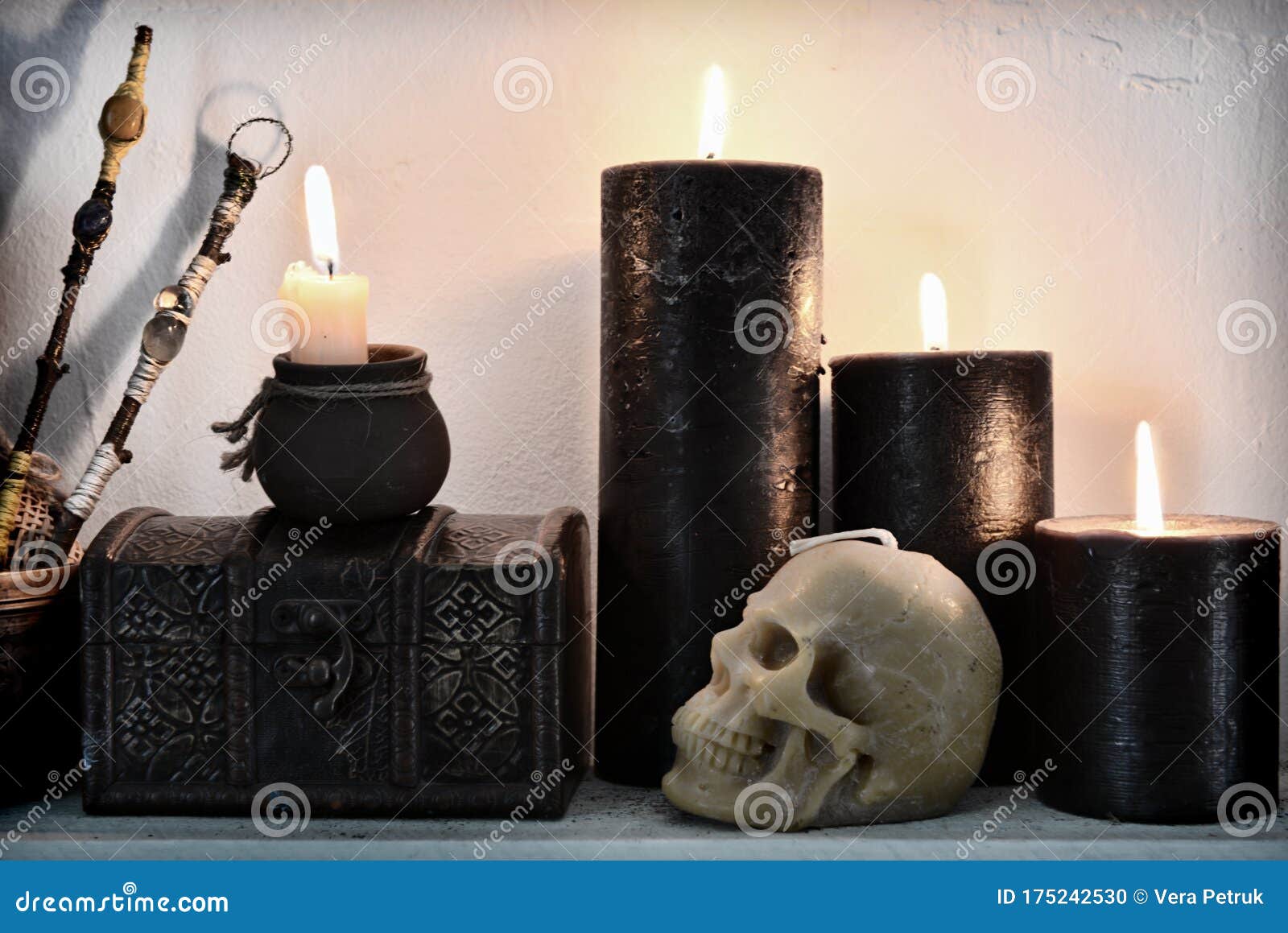 Burning Candles with Wax Skull and Withc Ritual Objects Stock Photo ...