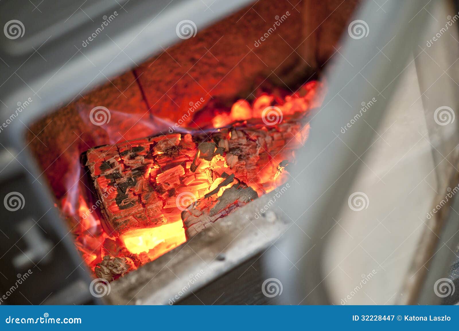 Burning Coals And Fire Through A Crack In The Cast Iron Lid Of The ...