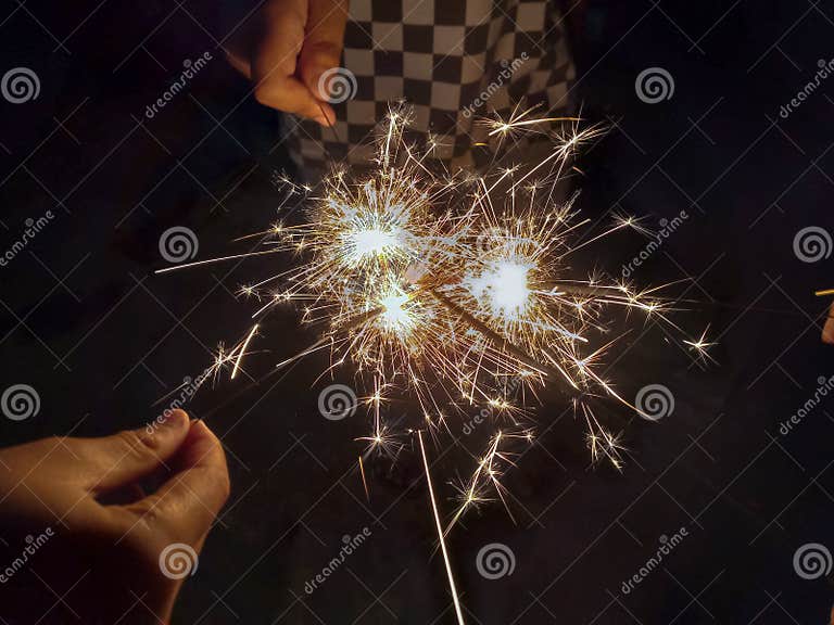 Burning Fireworks in Hands Outdoors Stock Image - Image of outdoors ...