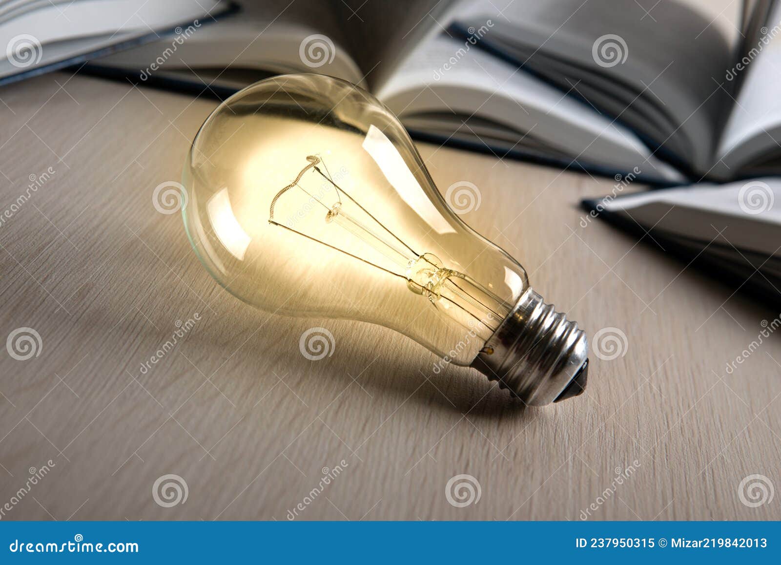 Burning Glass Bulb on the Background of Books Search for Ideas Stock ...