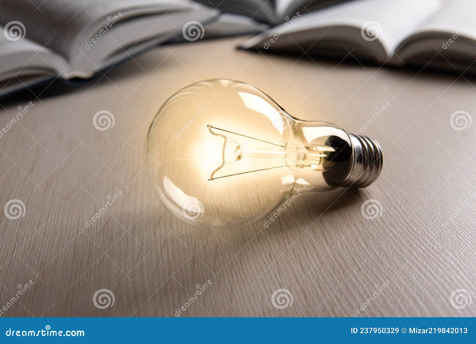 Burning Glass Bulb on the Background of Books Search for Ideas Stock ...