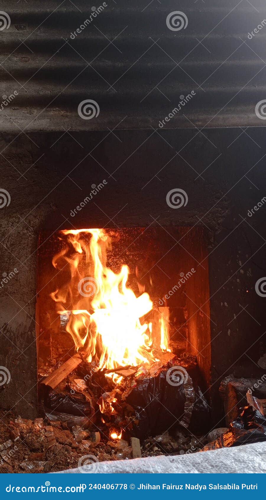 Burning Household Waste with a Big Fire and Some Wood Stock Photo ...