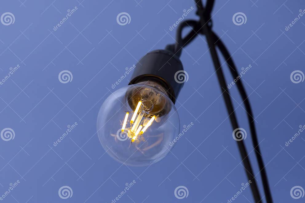 Burning Lamp on the Background of Blue Sky Stock Photo - Image of ...