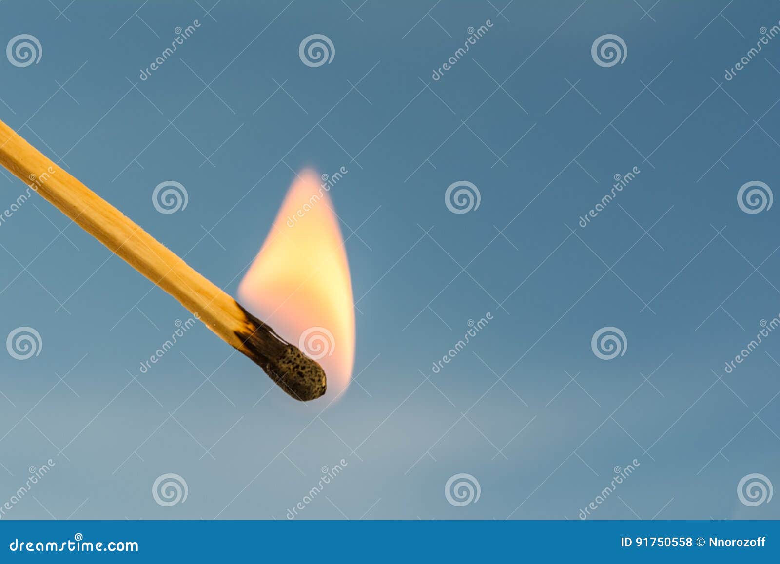 Burning Match on a Blue Background Stock Photo - Image of match, glow ...