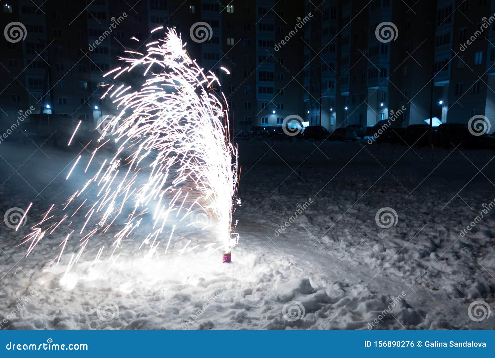 Burning Mini Fireworks in the Snow on a Winter Evening Stock Photo ...