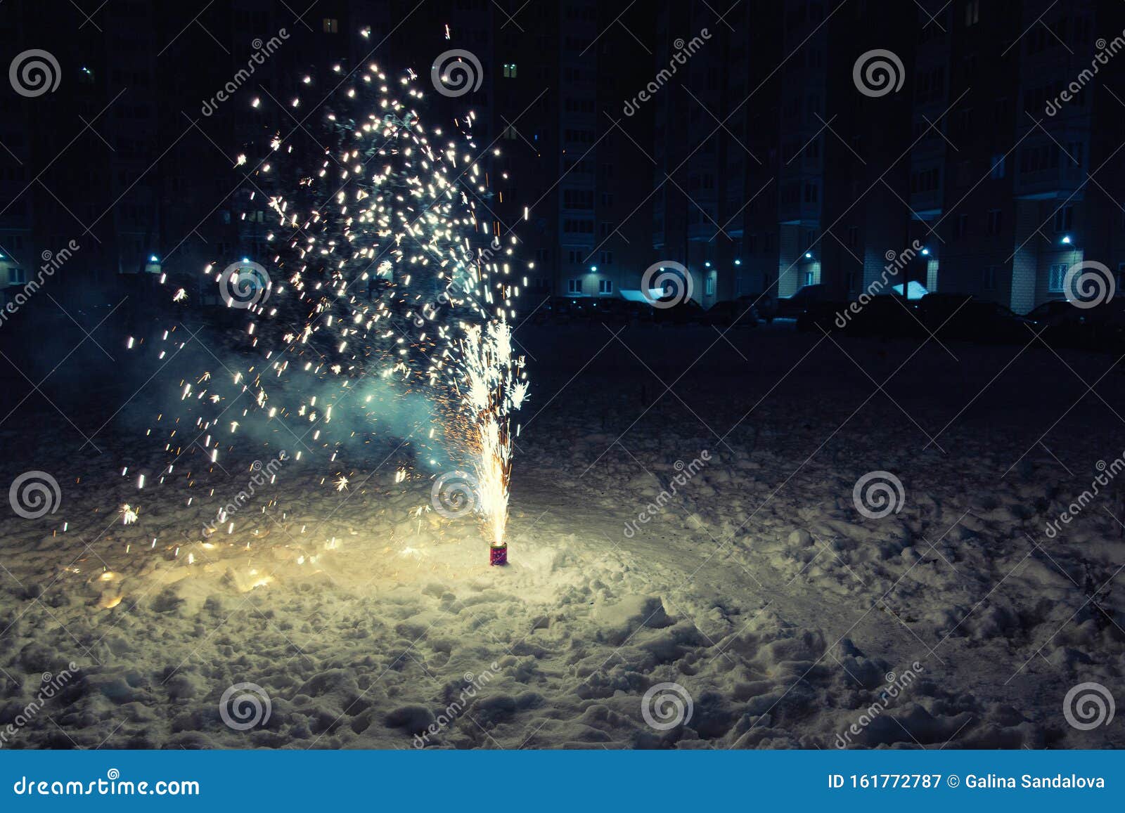 Burning Mini Fireworks in the Snow on a Winter Evening Stock Image ...