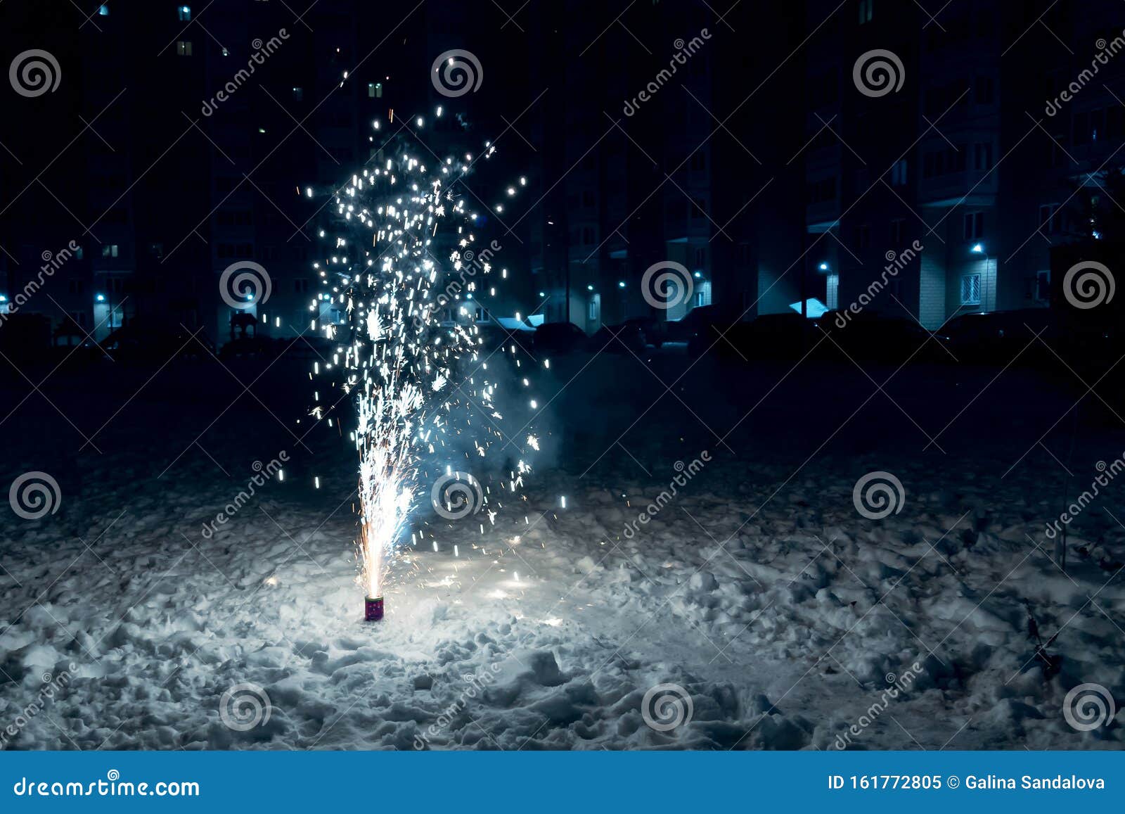 Burning Mini Fireworks in the Snow on a Winter Evening Stock Image ...