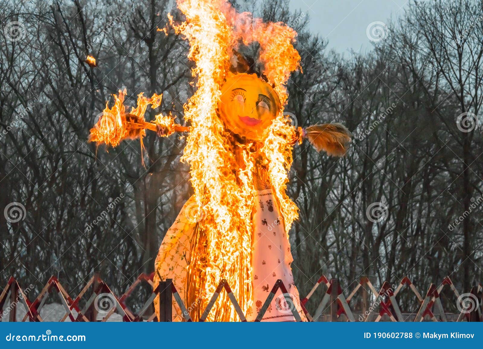 A Burning Scarecrow is in the Spring Park.Pagan Tradition, the Sun is ...