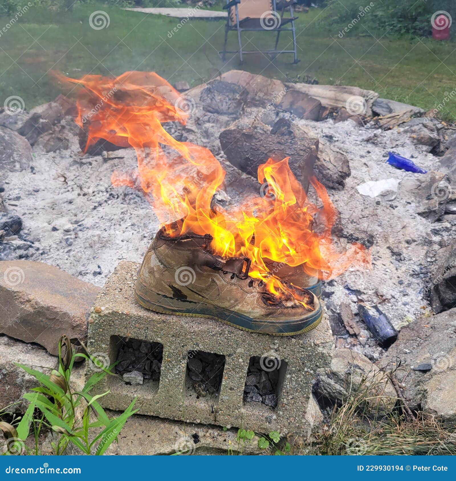 Burning shoes stock photo. Image of backyard, asphalt - 229930194