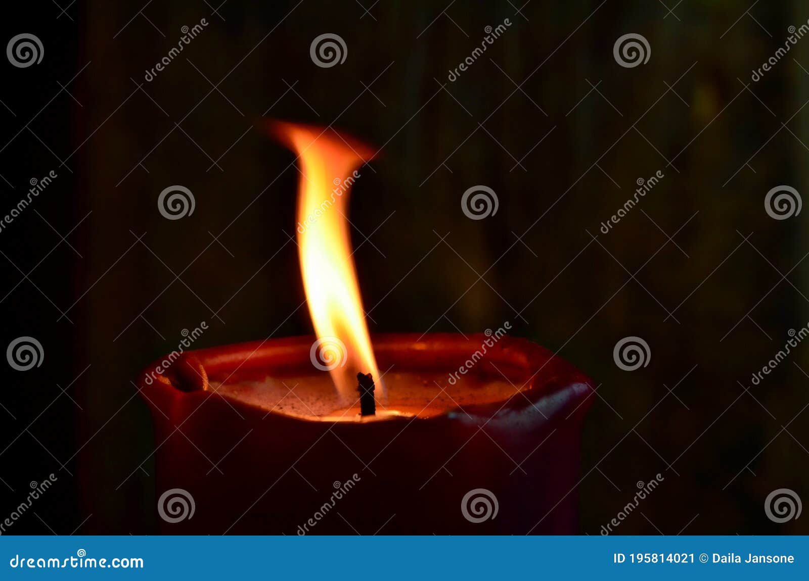 Burning Single Red Candle with Dancing Flame on the Dark Background ...