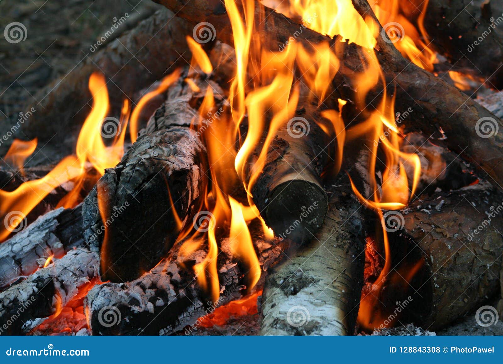 Burning and smoking wood stock photo. Image of flame - 128843308