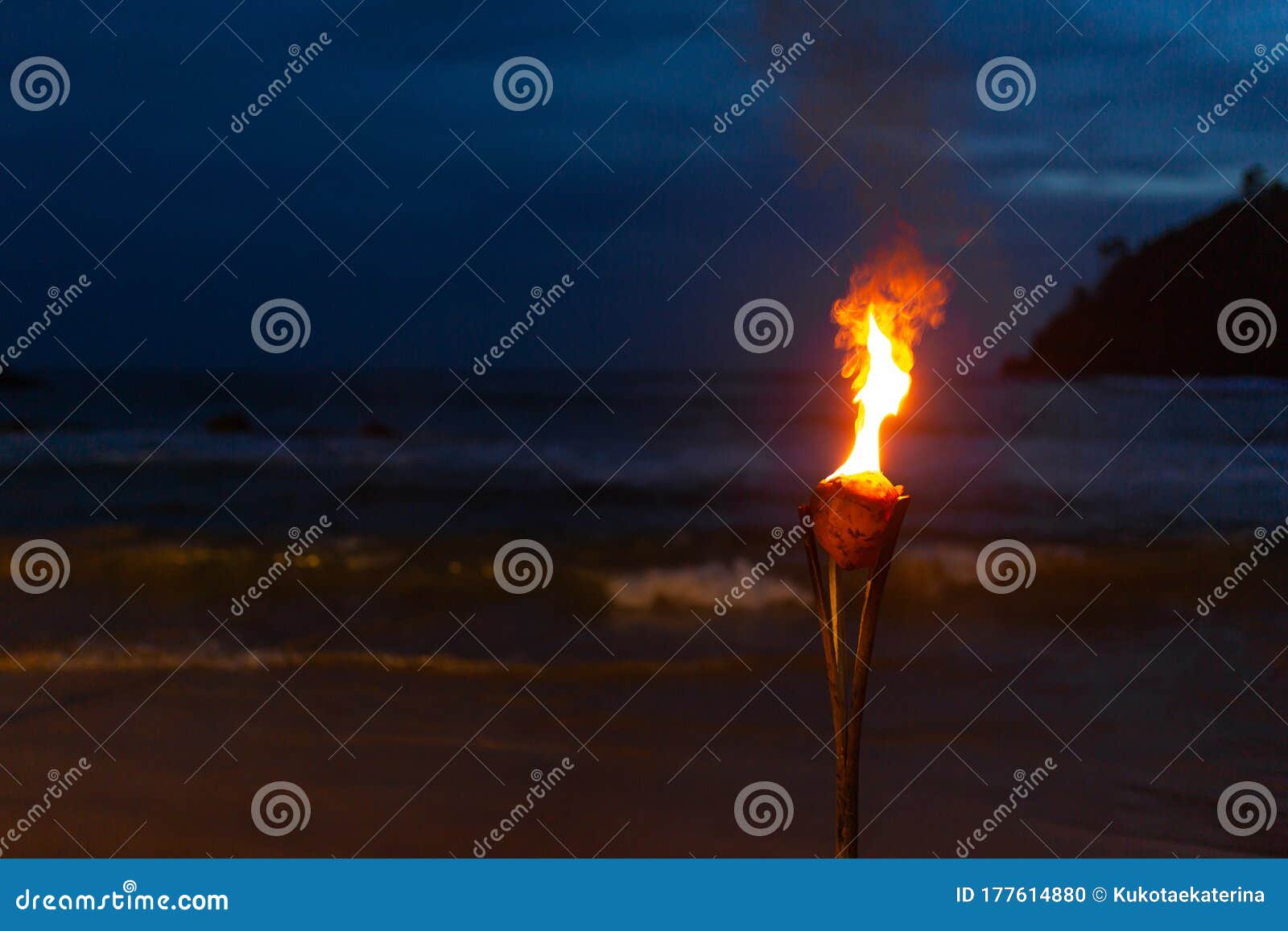 Burning Torch on the Sandy Beach of the Ocean Stock Photo - Image of ...